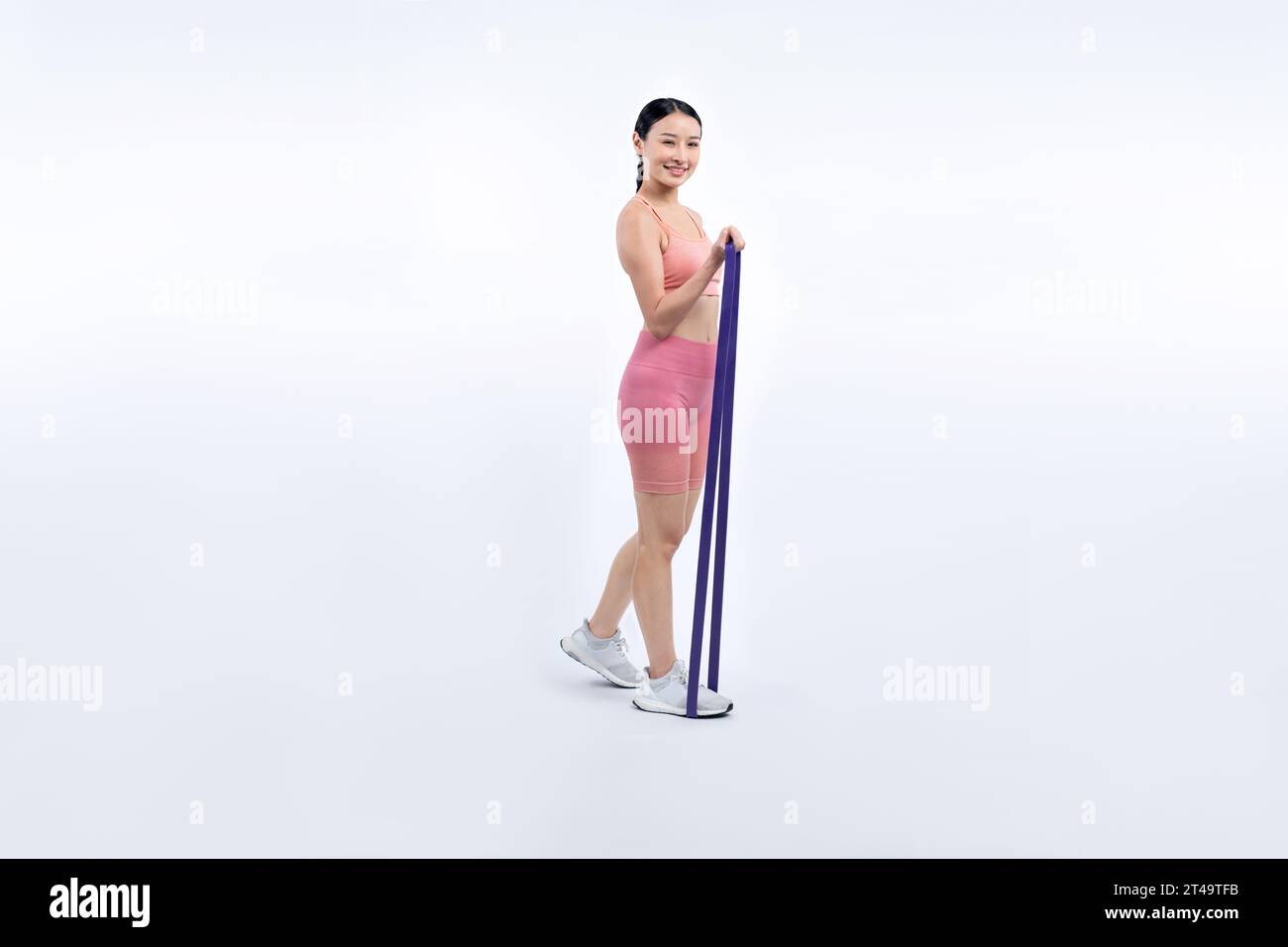 Vigorous Energetic Woman In Sportswear Portrait Stretching Resistance