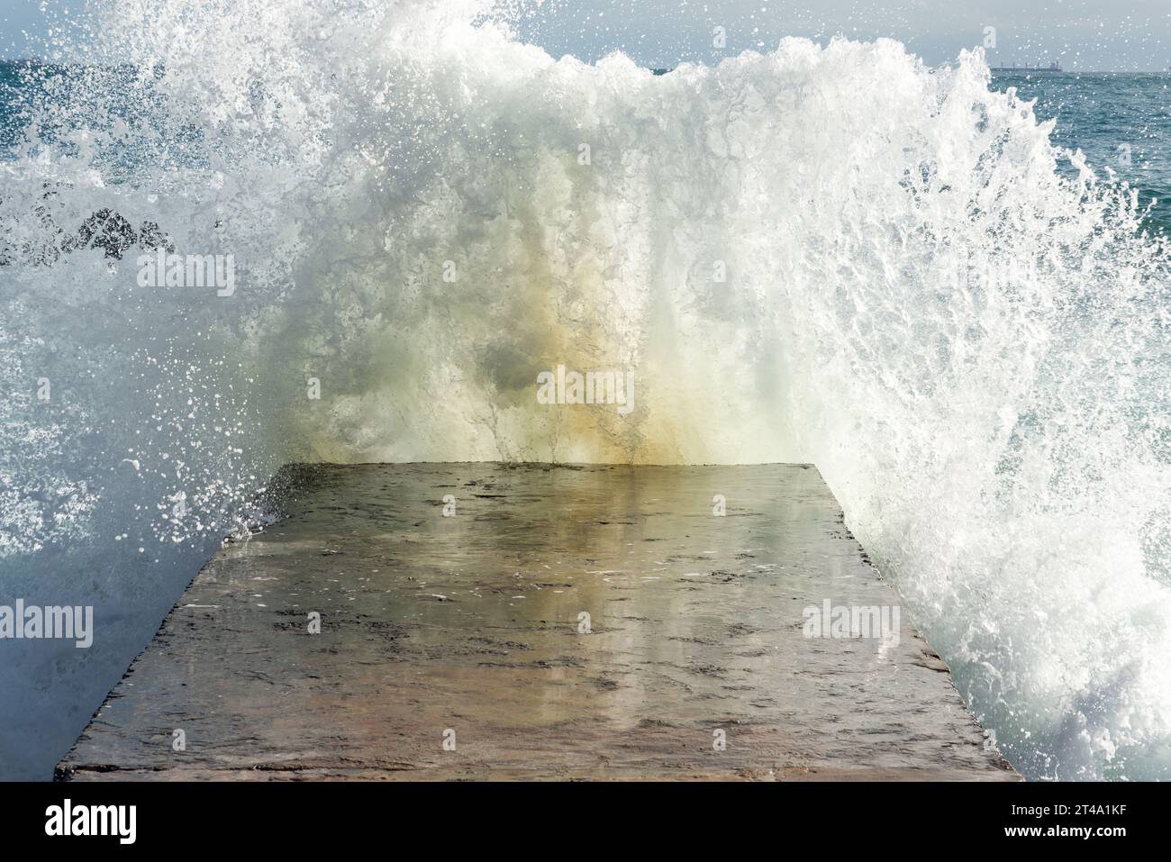 Sea waves hit the cement pier on a beach. Wild nature. Seasons Stock ...