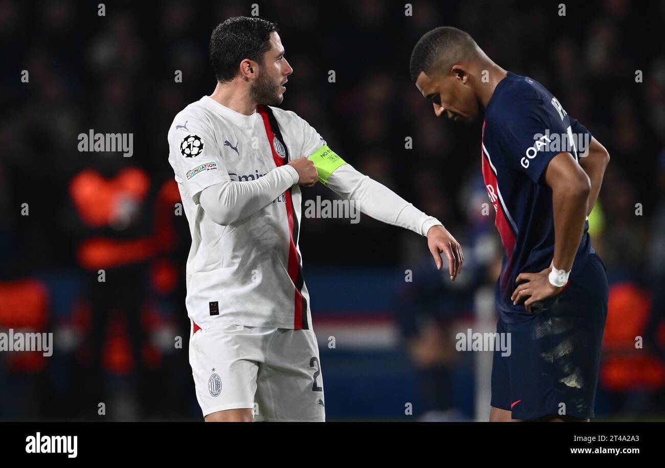PARIS, FRANCE - OCTOBER 25: Davide Calabria of AC Milan and Kylian Mbappe of Paris Saint-Germain ...