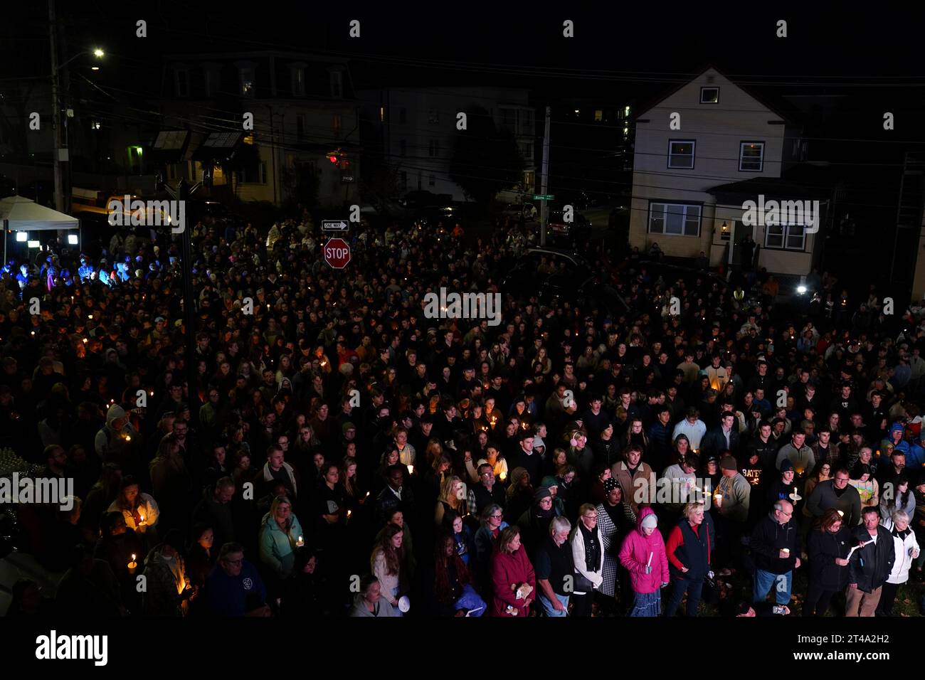 People gather at a vigil for the victims of Wednesday's mass shootings ...