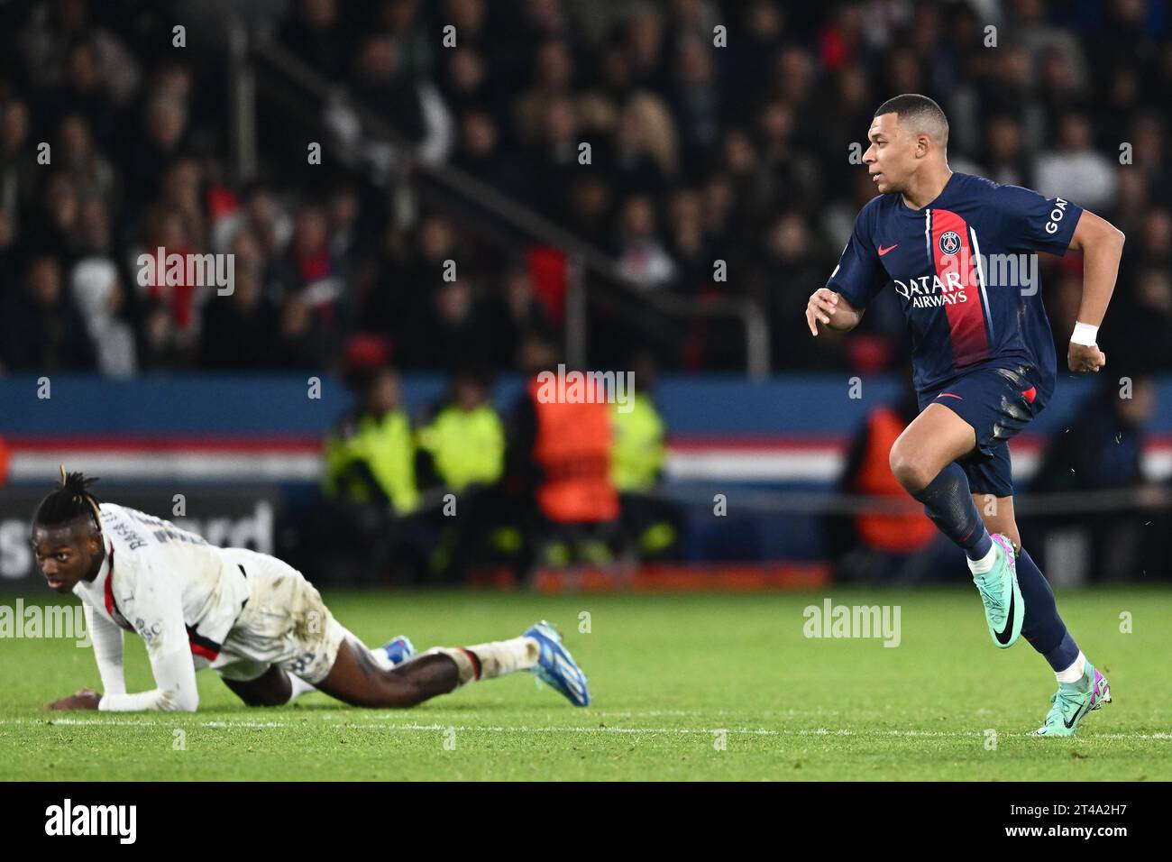 PARIS, FRANCE - OCTOBER 25: Rafael Leao of AC Milan and Kylian Mbappe of Paris Saint-Germain ...