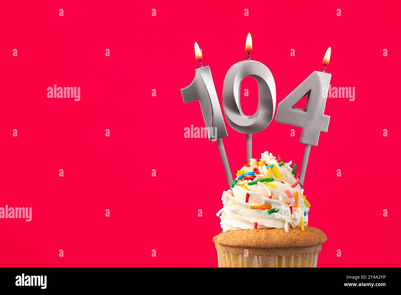 Burning candle number 104 - Birthday card with cake Stock Photo - Alamy
