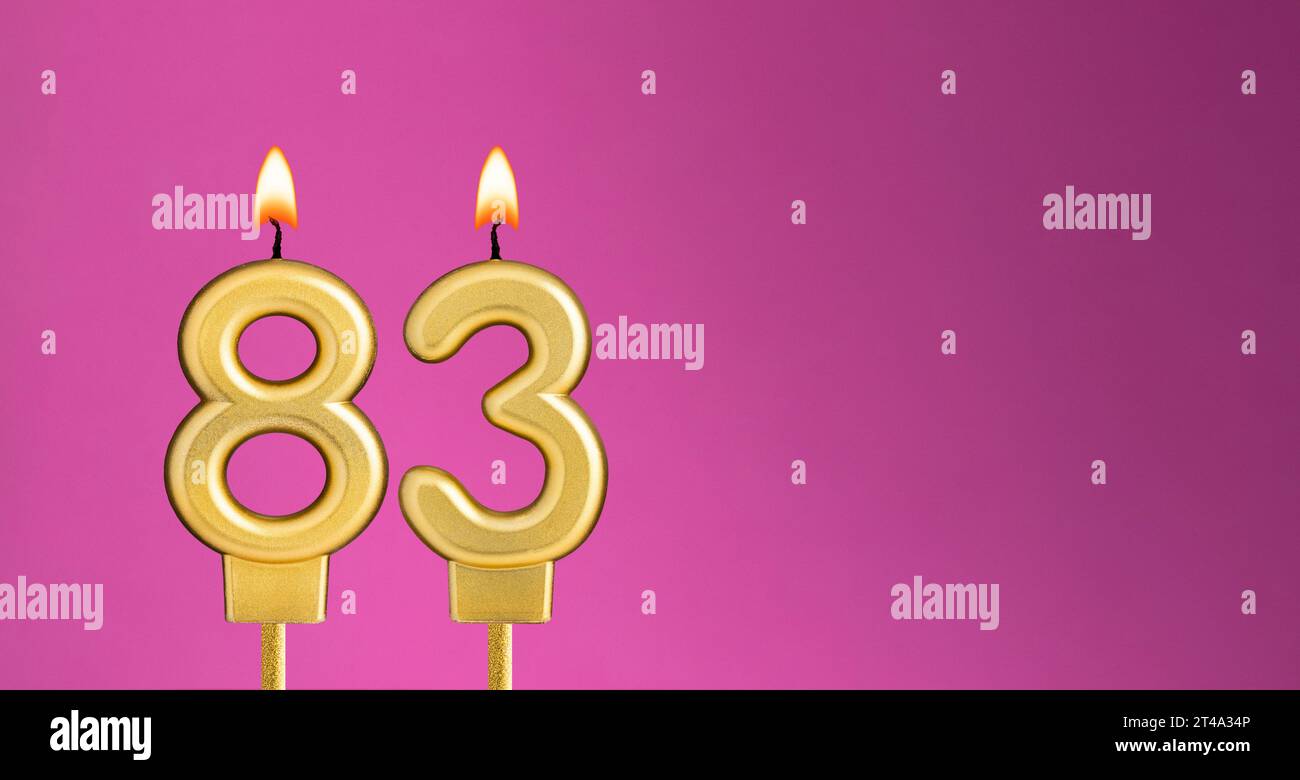 Candle number 83 in purple background - birthday card Stock Photo - Alamy