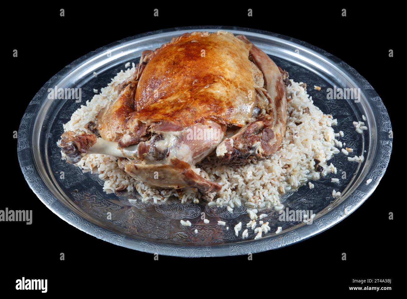 Stuffed lamb ribs. Lamb ribs on rice. Stuffed Ribs isolated on black ...