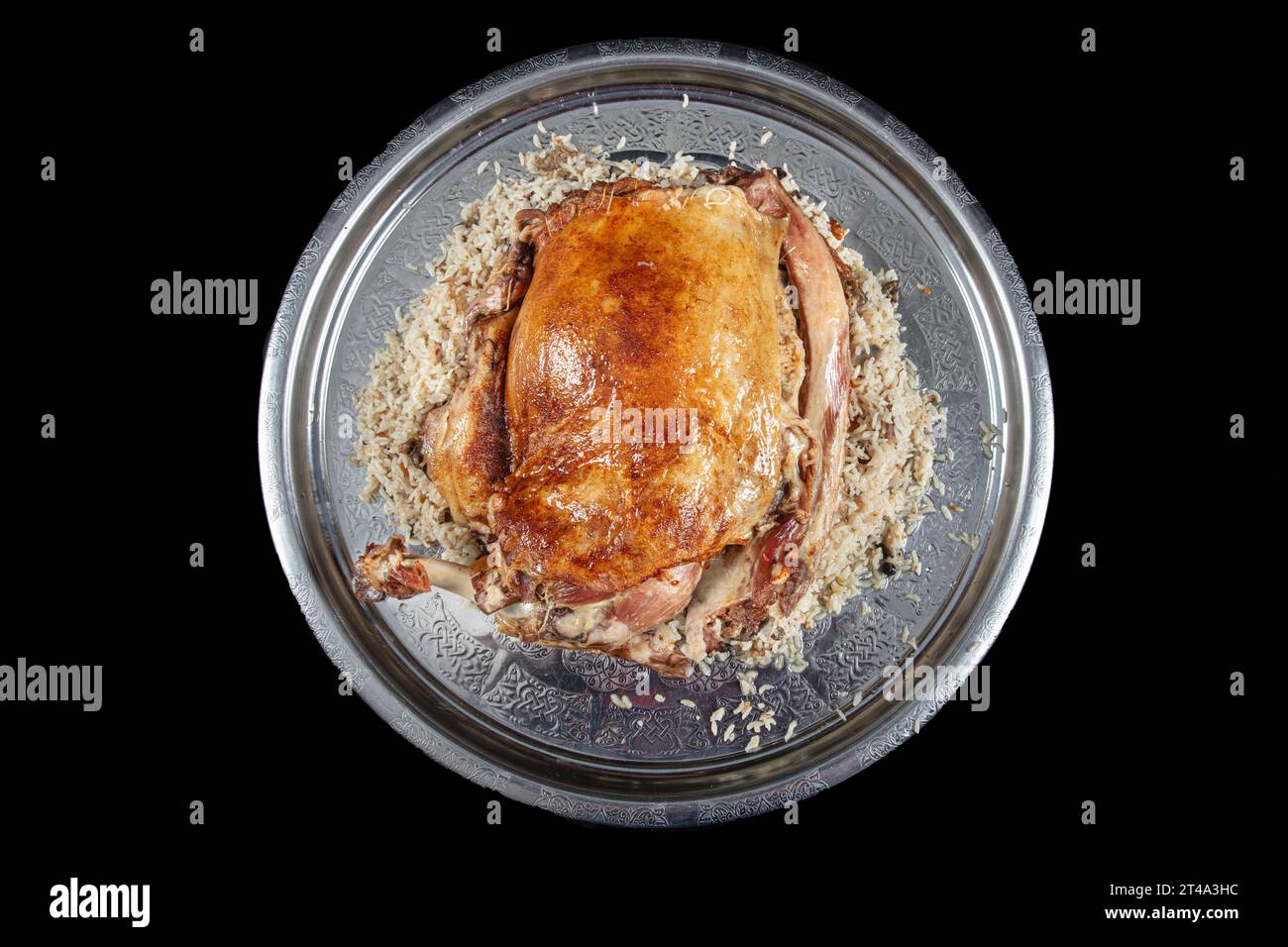 Stuffed lamb ribs. Lamb ribs on rice. Stuffed Ribs isolated on black ...