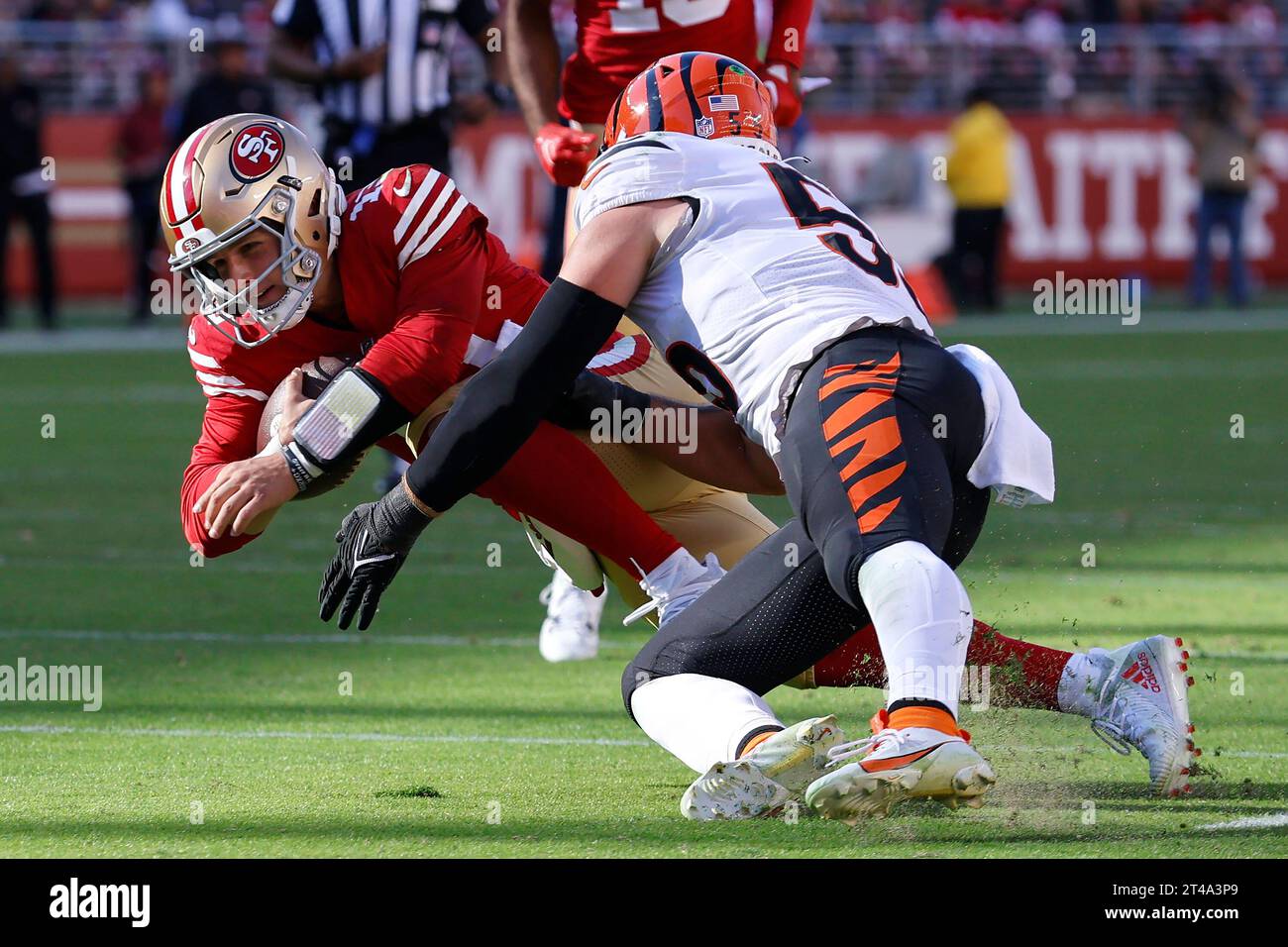 San Francisco 49ers quarterback Brock Purdy, left, runs against ...