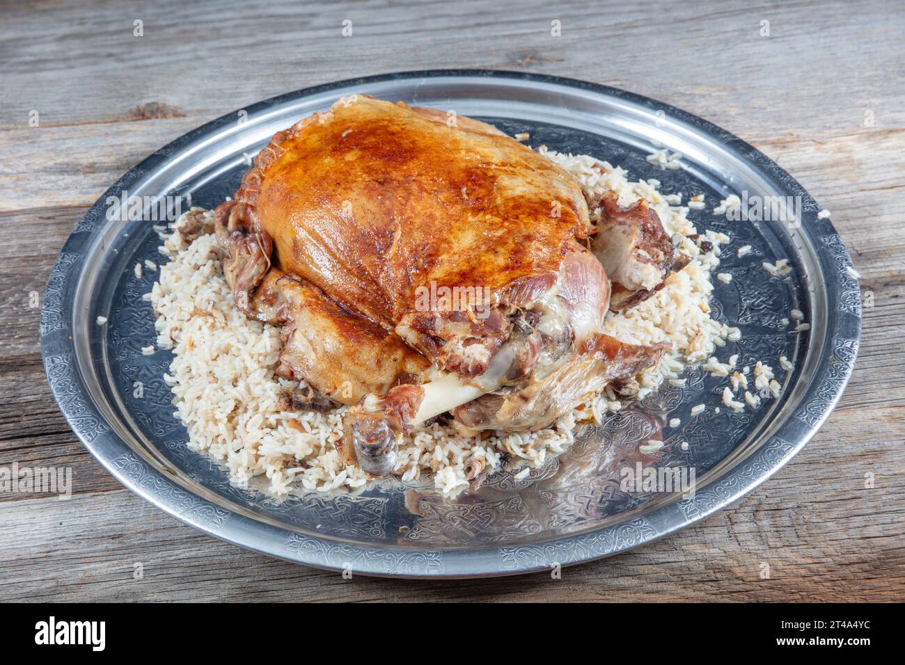 Stuffed lamb ribs. Lamb ribs on rice. Stuffed Ribs isolated on black ...