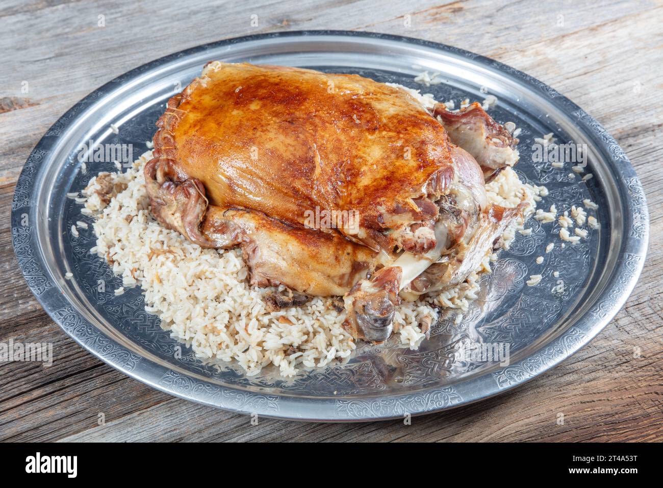 Stuffed lamb ribs. Lamb ribs on rice. Stuffed Ribs isolated on black ...