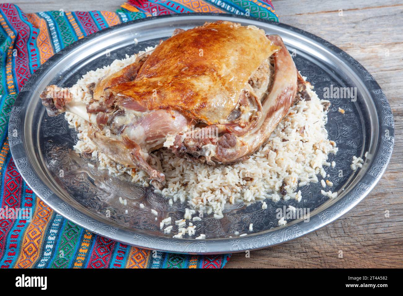 Stuffed lamb ribs. Lamb ribs on rice. Stuffed Ribs isolated on black ...