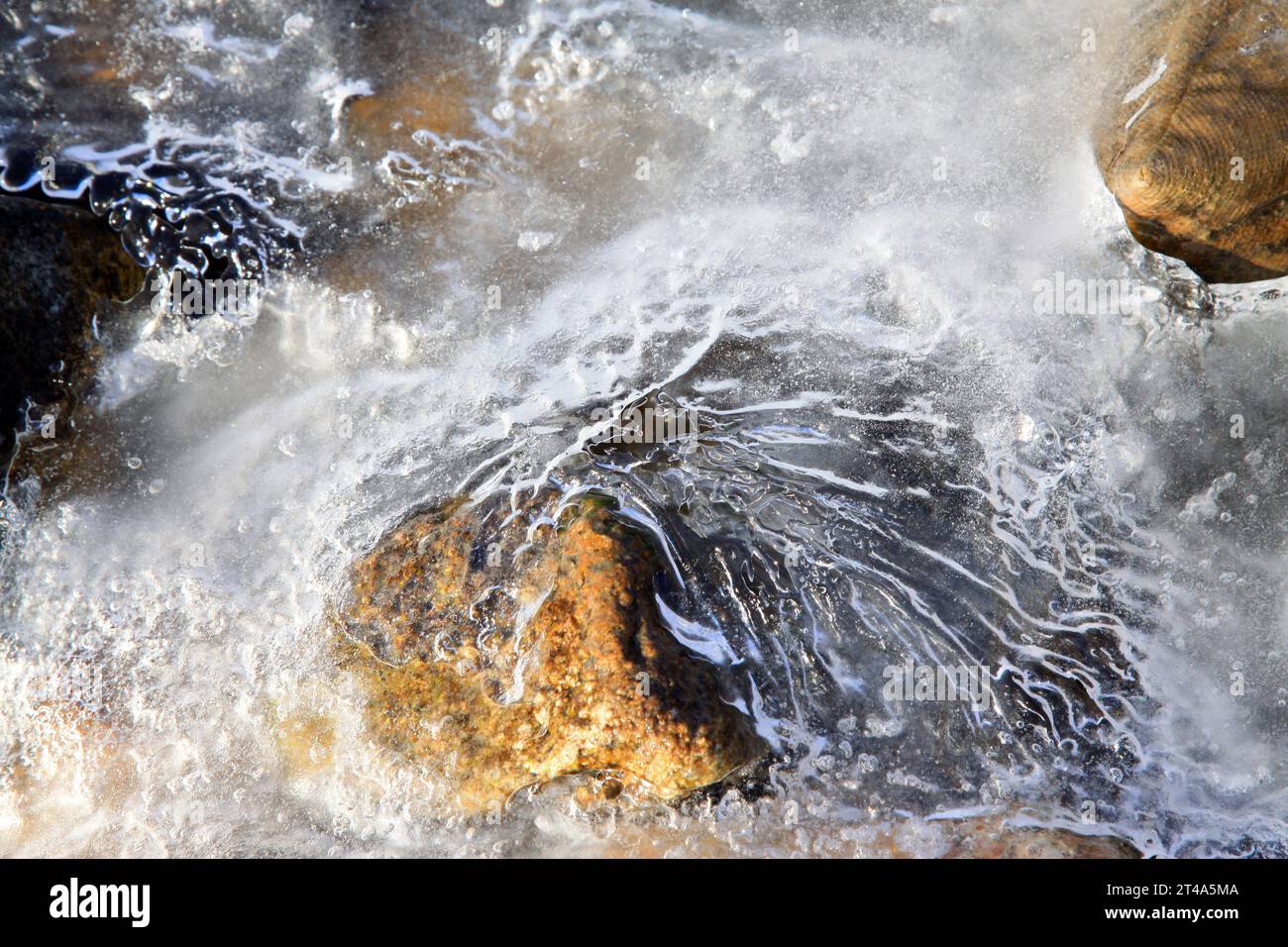melting ice and rock in the wild Stock Photo - Alamy