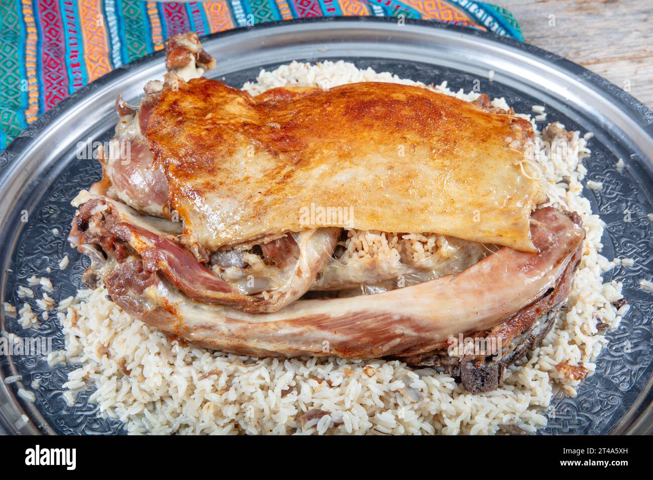 Stuffed lamb ribs. Lamb ribs on rice. Stuffed Ribs isolated on black ...