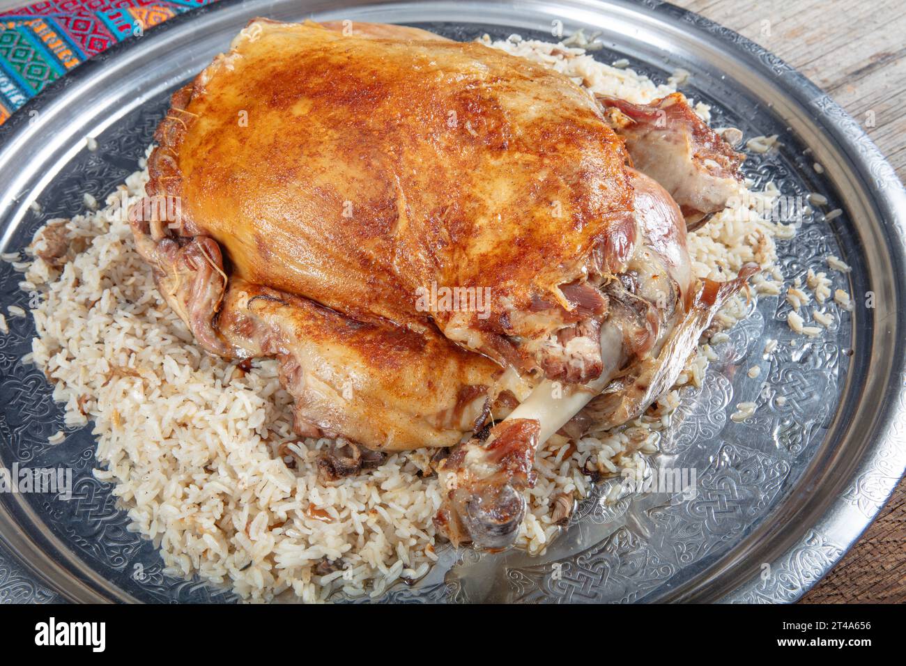 Stuffed lamb ribs. Lamb ribs on rice. Stuffed Ribs isolated on black ...