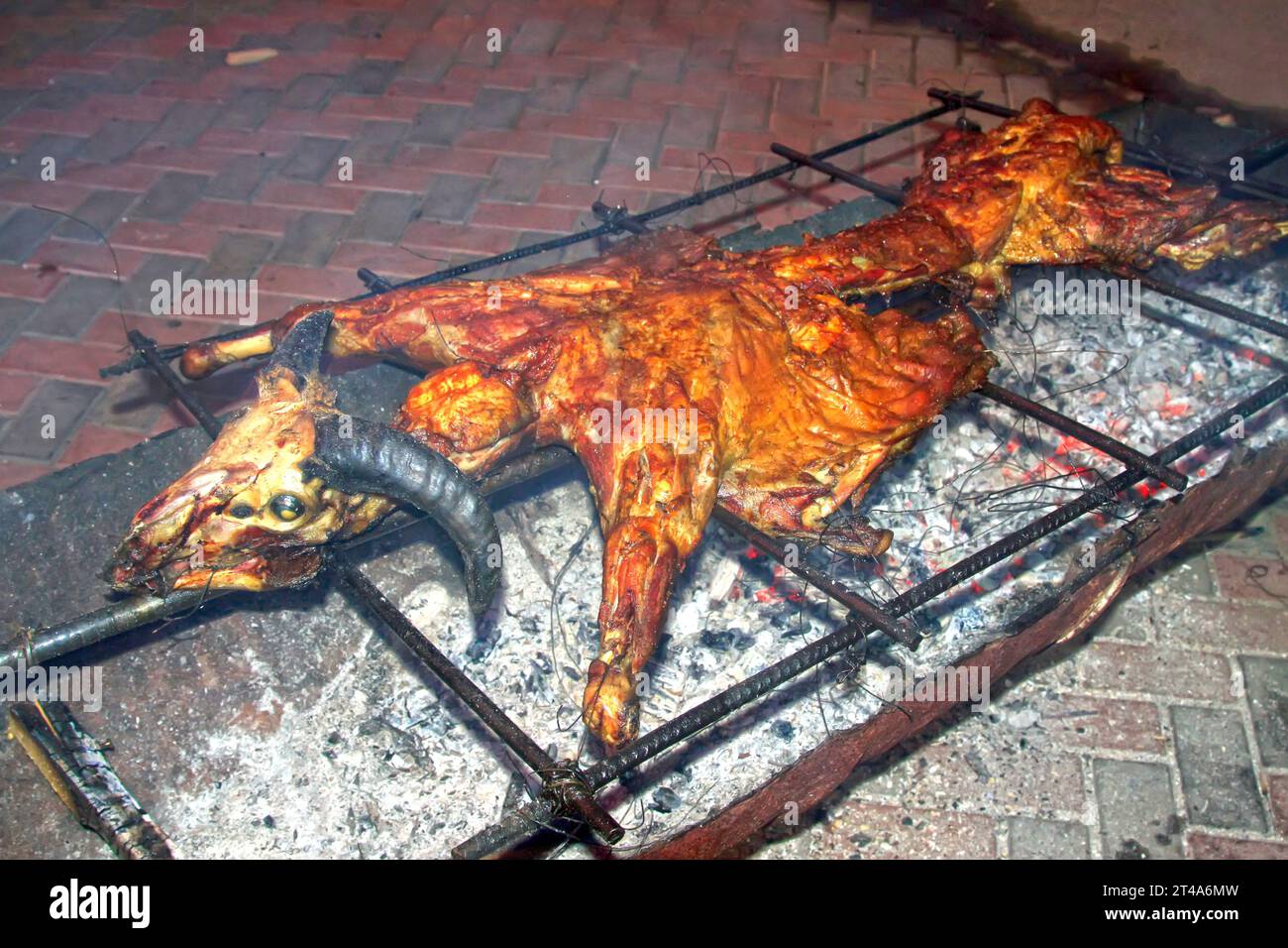 roast whole lamb on the iron frame, in the WuLanBuTong grassland, China ...