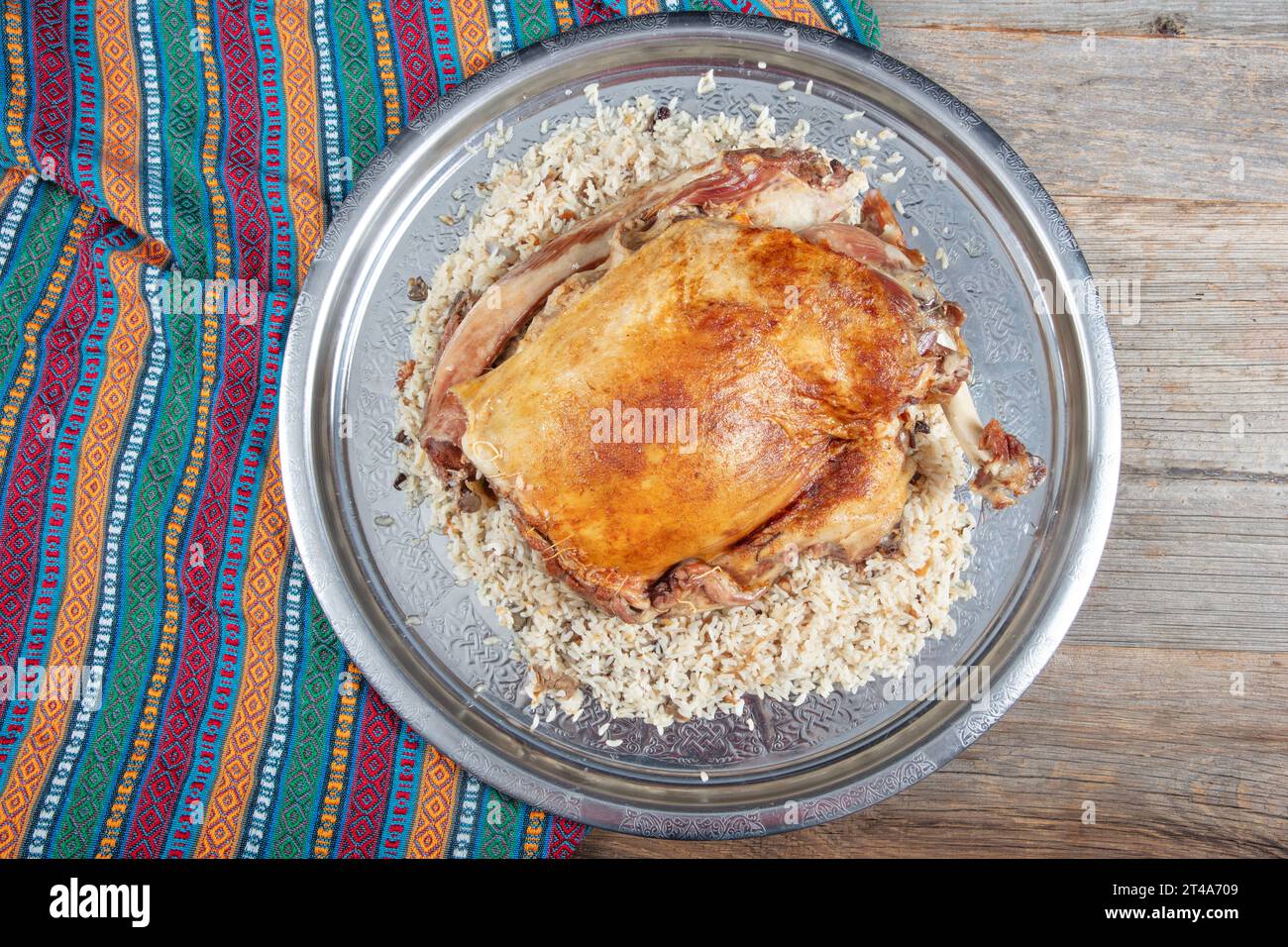 Stuffed lamb ribs. Lamb ribs on rice. Stuffed Ribs isolated on black ...