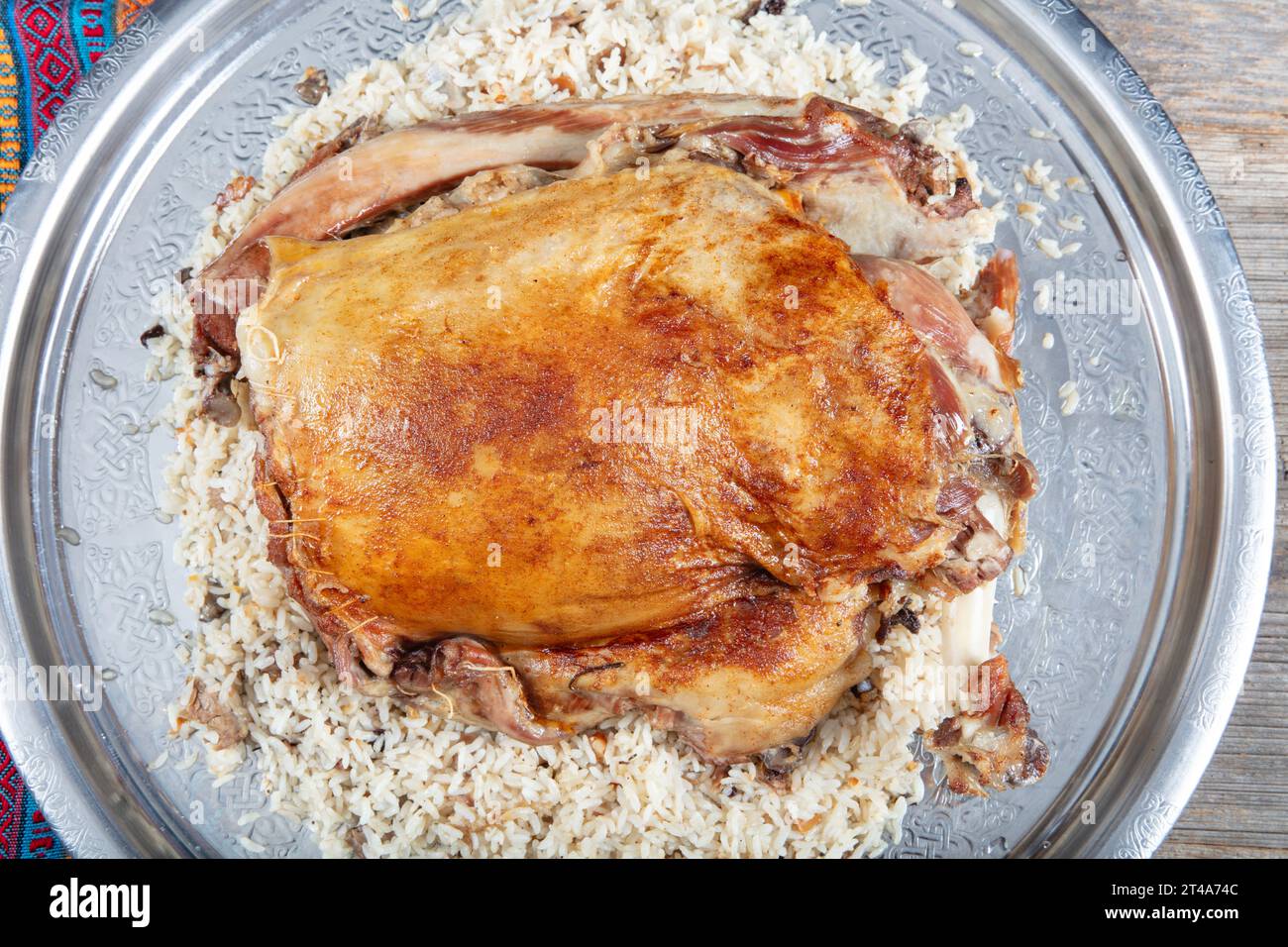 Stuffed lamb ribs. Lamb ribs on rice. Stuffed Ribs isolated on black ...