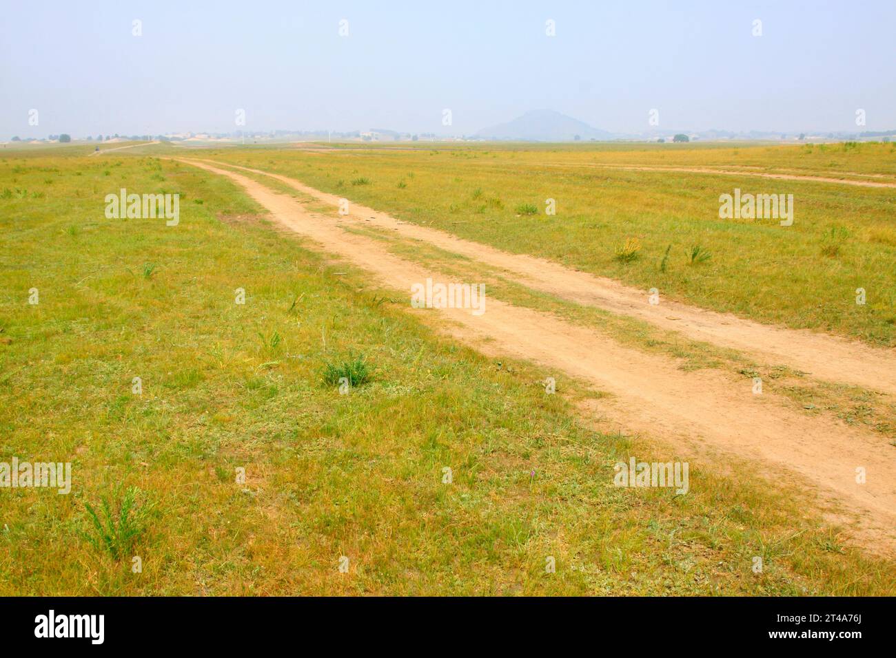 unsurfaced road in the WuLanBuTong grassland, Inner Mongolia autonomous ...