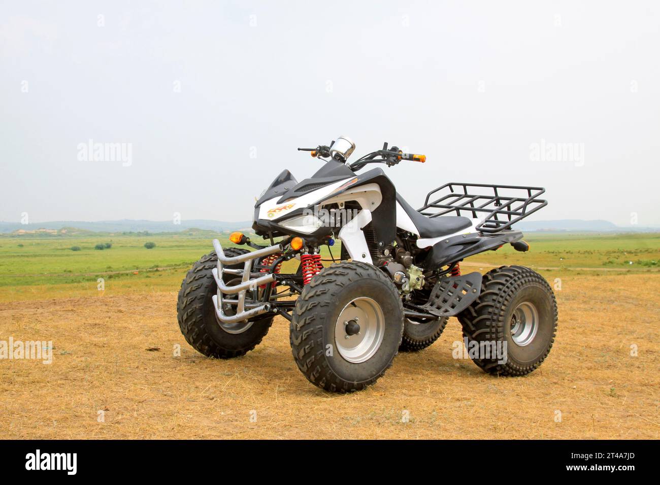 four wheels motorcycle on the grassland, closeup of photo Stock Photo ...
