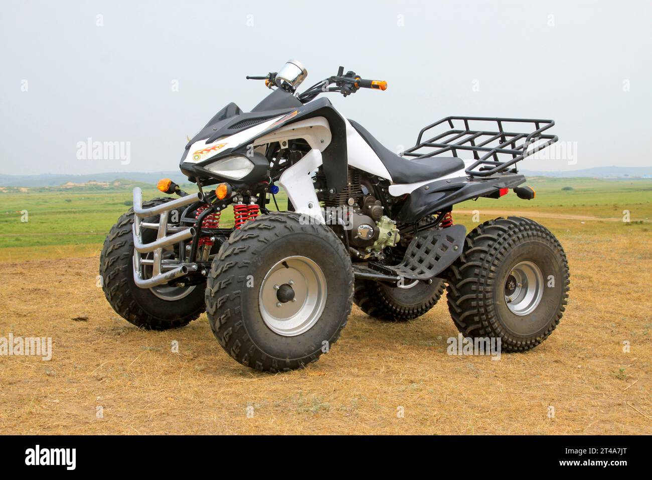 four wheels motorcycle on the grassland, closeup of photo Stock Photo ...