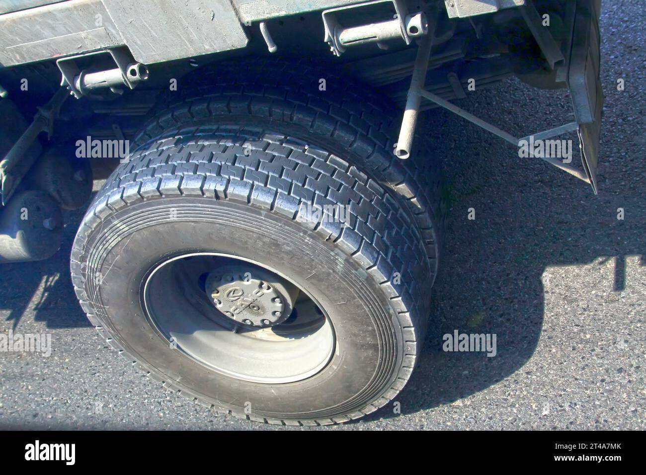 Overloaded truck wheels, closeup of photo Stock Photo - Alamy