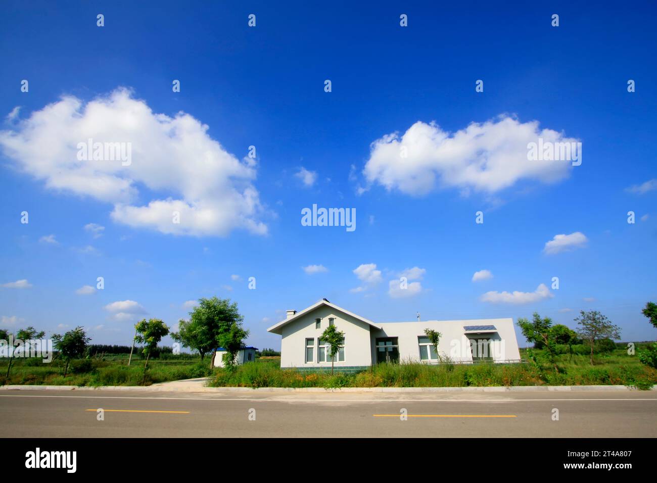 small house under the blue sky and white cloud, closeup of photo Stock ...