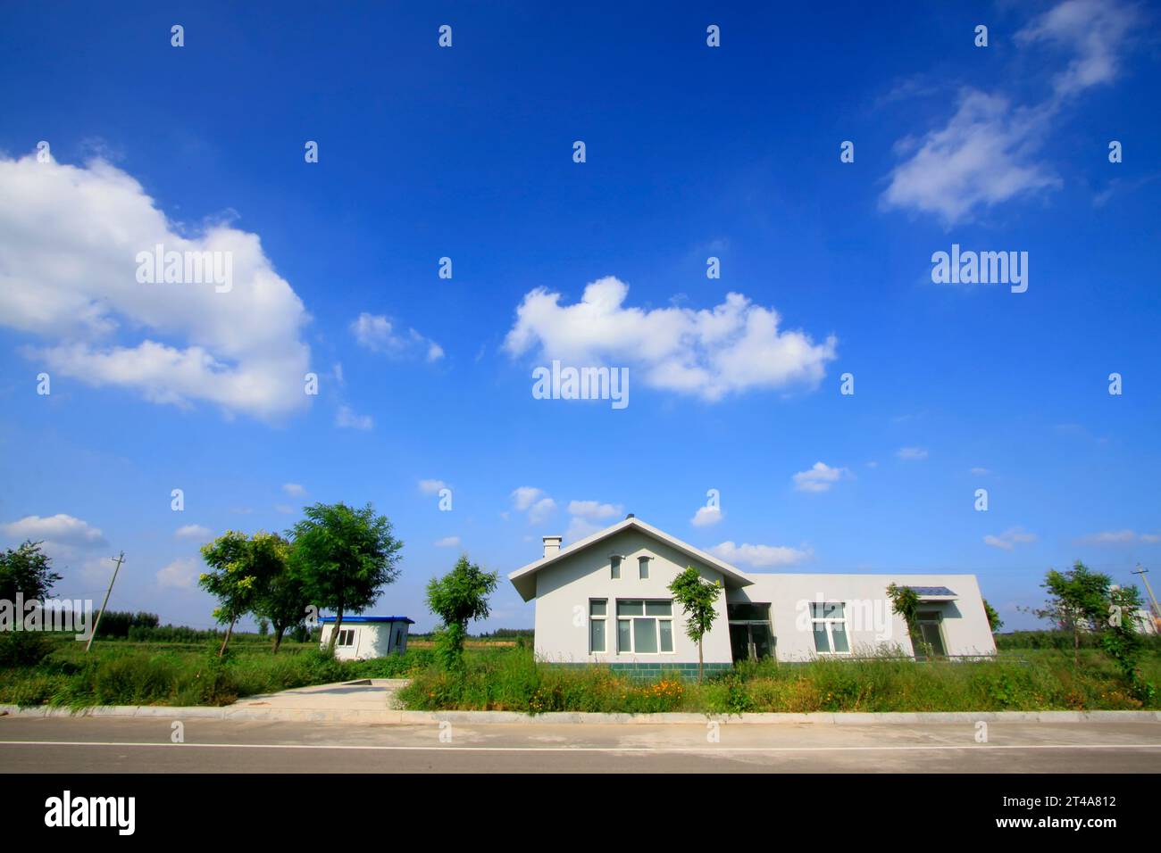 small house under the blue sky and white cloud, closeup of photo Stock ...