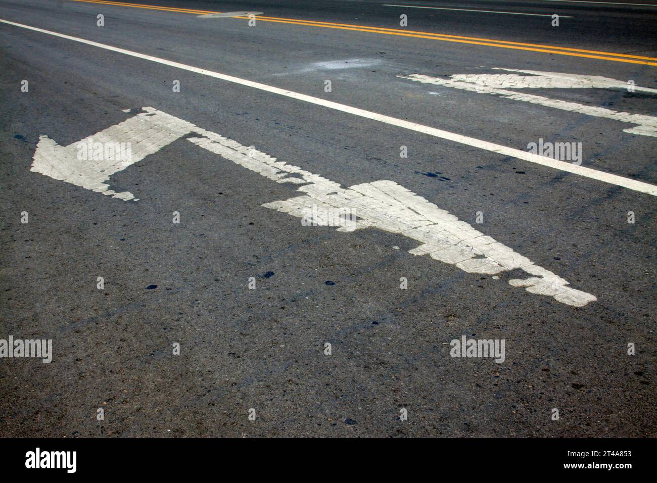 arrow mark on asphalt pavement Stock Photo - Alamy