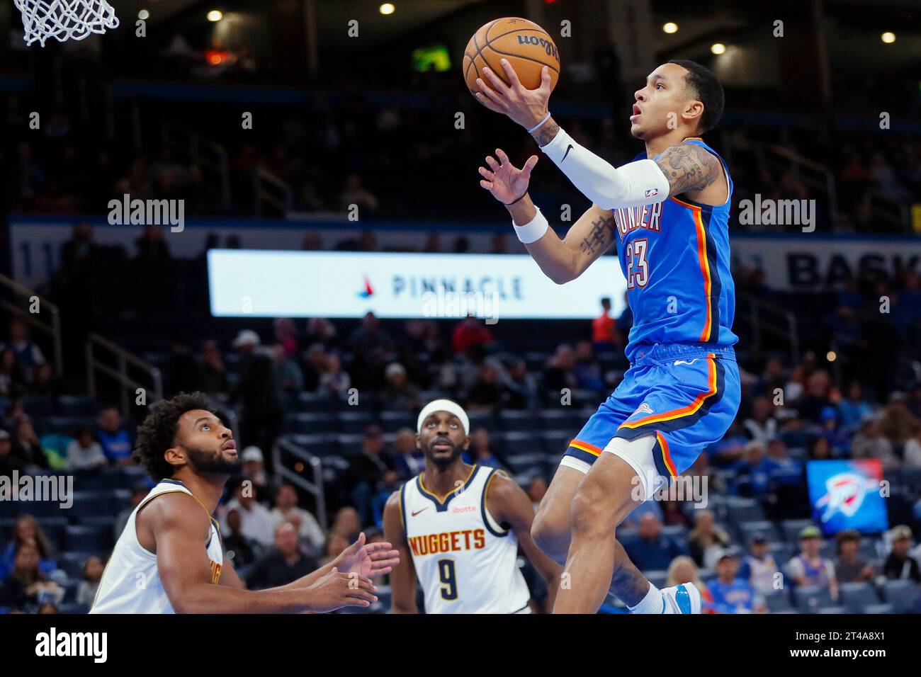 Oklahoma City Thunder guard Tre Mann (23) shoots near Denver Nuggets ...