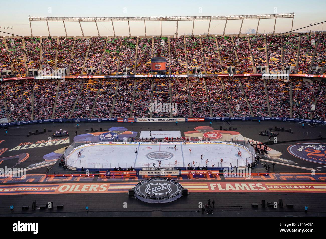 Fans look on as the Calgary Flames and the Edmonton Oilers face off ...