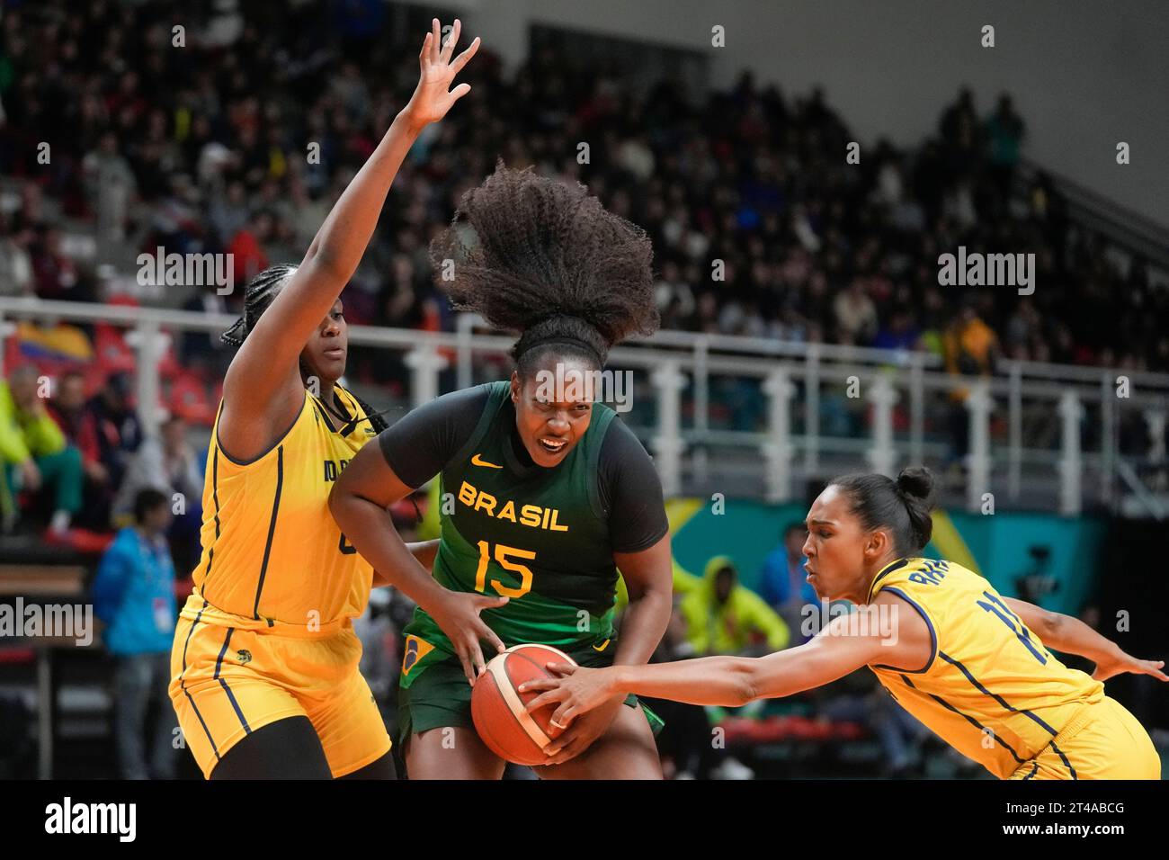 Colombia's Yanet Arias, right, blocks Brazil's Licinara Rodrigues in ...