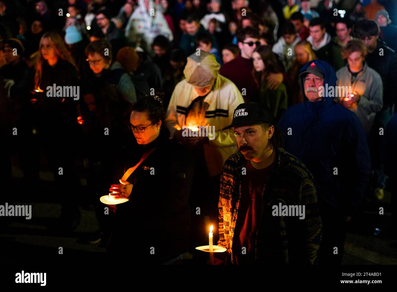 People gather at a vigil for the victims of Wednesday's mass shootings ...