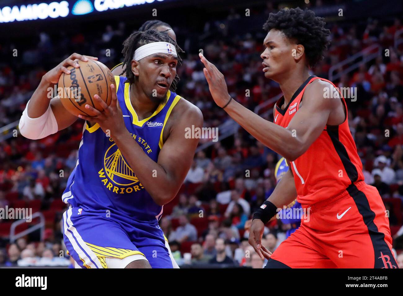 Golden State Warriors forward Kevon Looney, left, looks to drive around ...