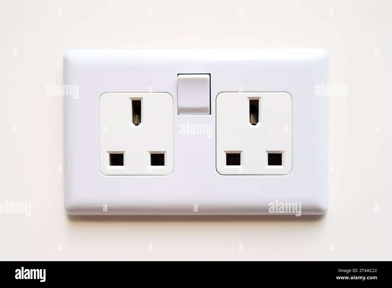 White wall mounted socket board with two electrical sockets and a ...