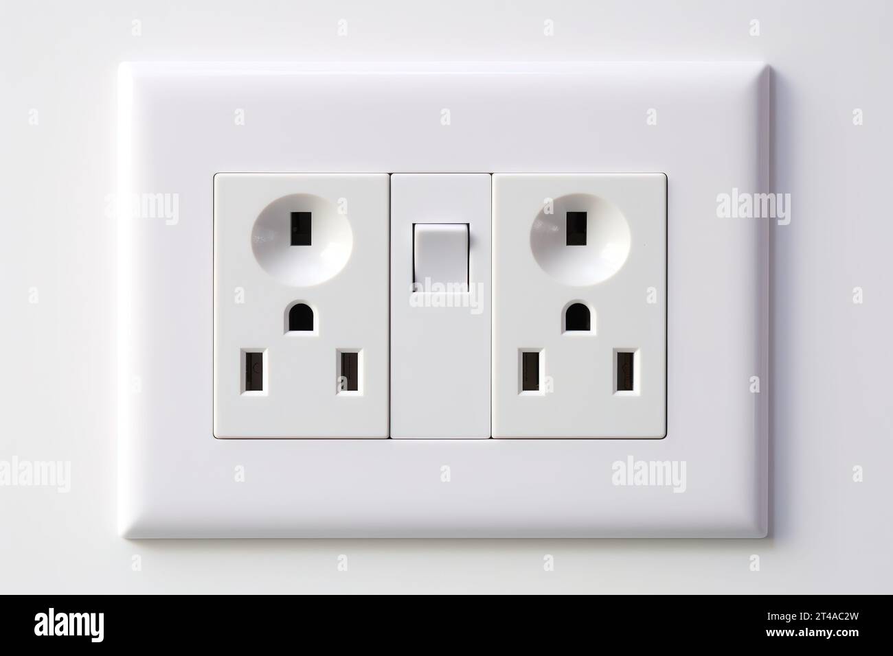 White wall mounted socket board with two electrical sockets and a ...