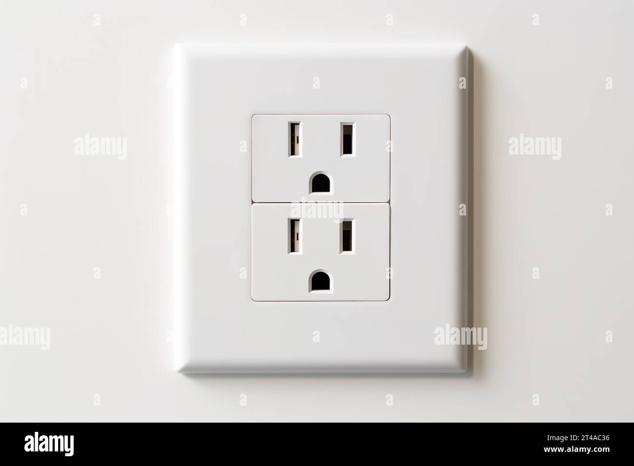 White wall mounted socket board with two electrical sockets and a ...