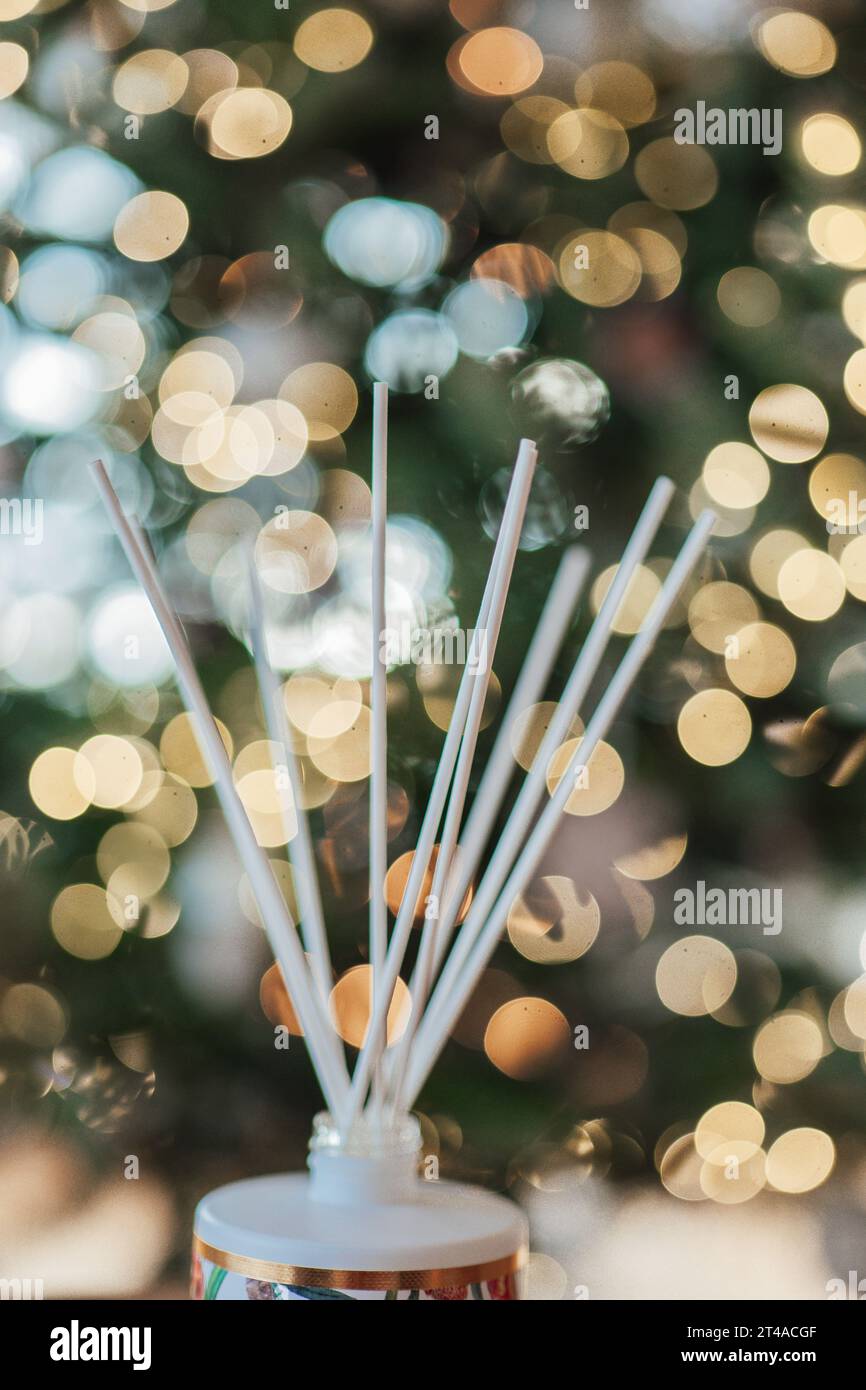 Christmas Diffuser with sticks with aroma on Christmas shining tree ...