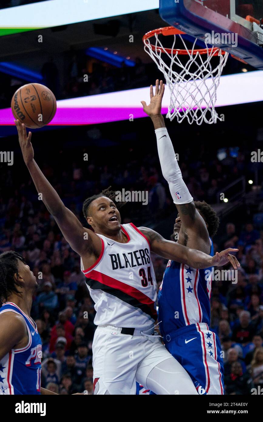 Portland Trail Blazers' Jabari Walker, left, shoots against ...