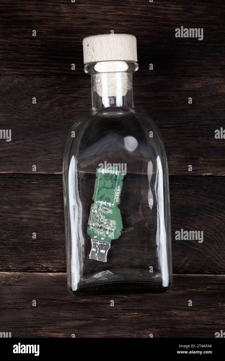 USB memory stick as letter in vintage bottle on wooden deck Stock Photo ...