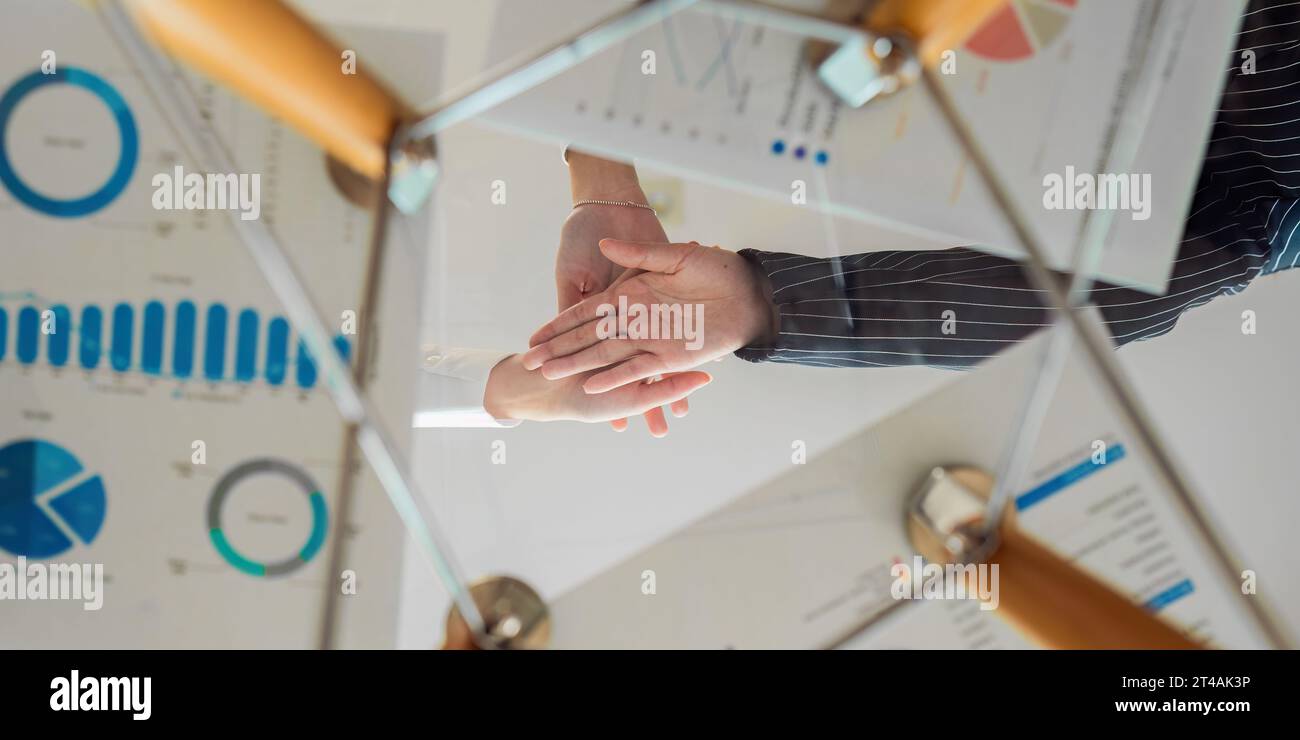 young business people putting their hands together. Stack of hands. Unity and teamwork concept ...