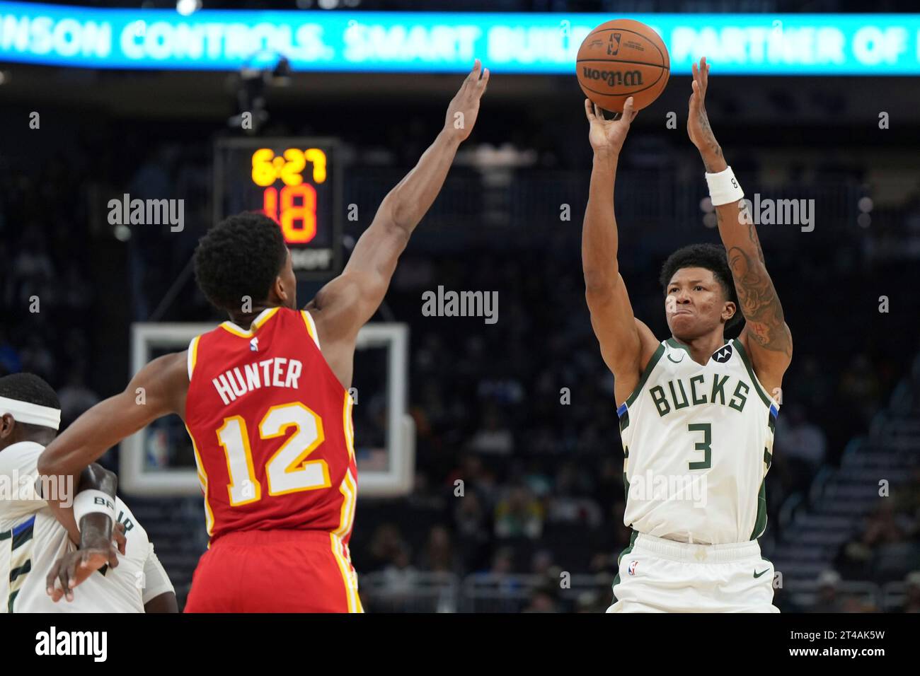 Milwaukee Bucks' MarJon Beauchamp (3) shoots for three points as he is ...