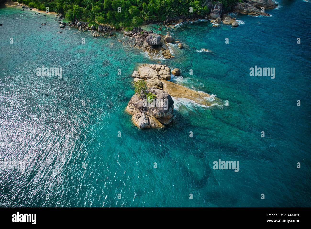 Drone bird eye view at Anse solei beach, turquoise and calm sea and huge granite stones with ...
