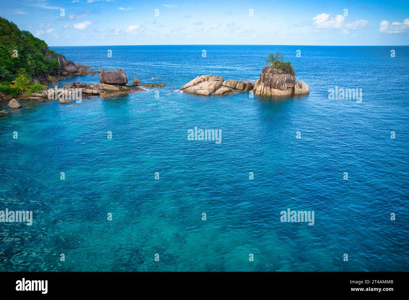 Drone bird eye view at Anse solei beach, turquoise and calm sea and huge granite stones with ...