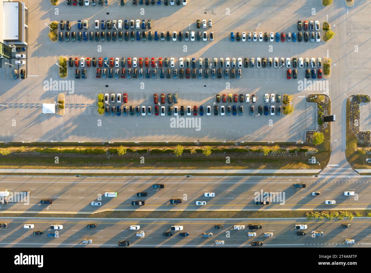 Aerial view of dealership parking lot with many brand new cars for sale ...