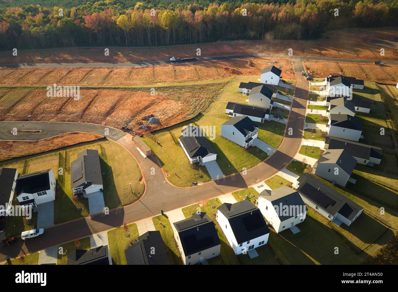 Aerial view of real estate development with tightly located family ...