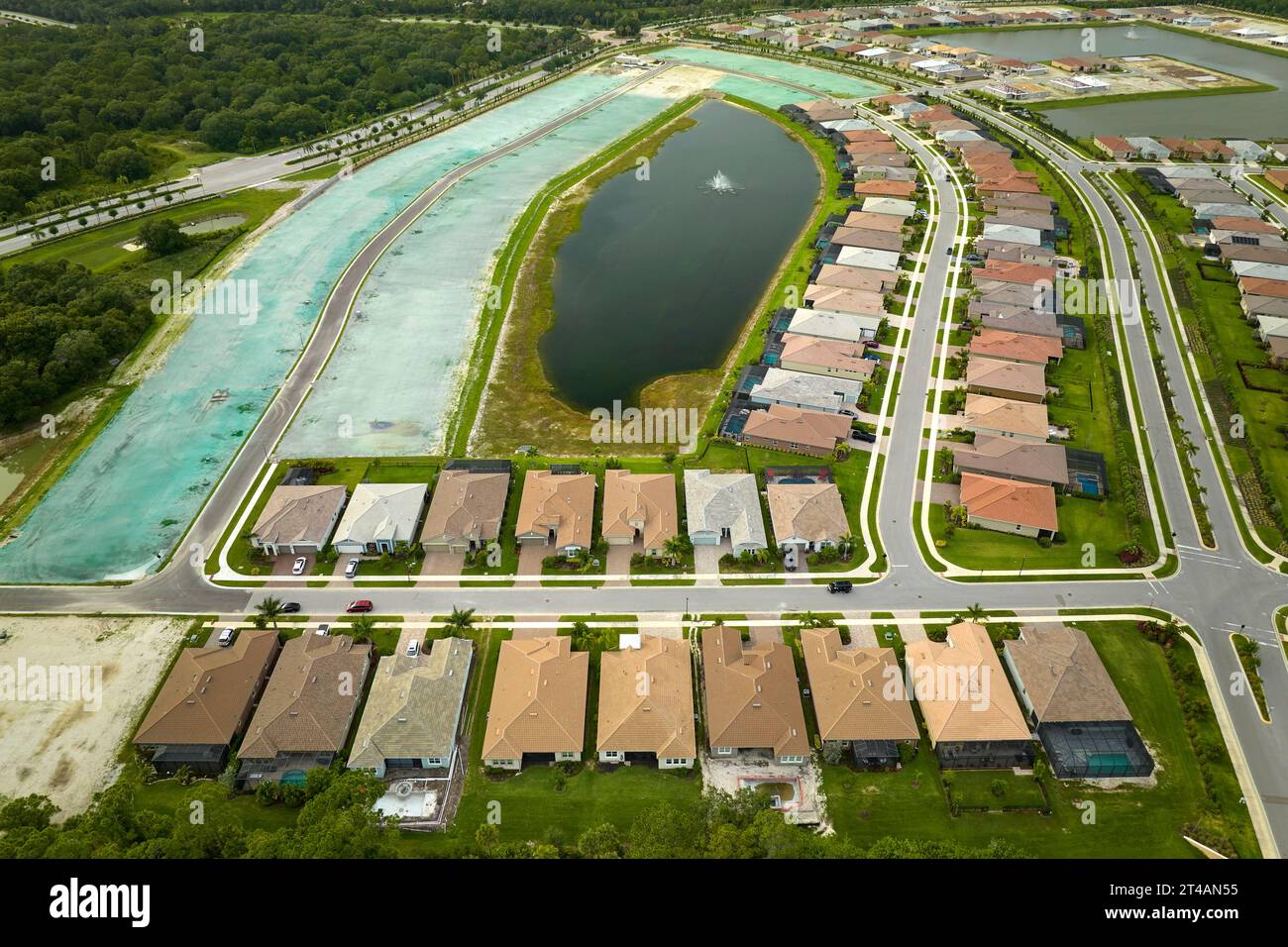 Aerial view of real estate development with tightly located family ...