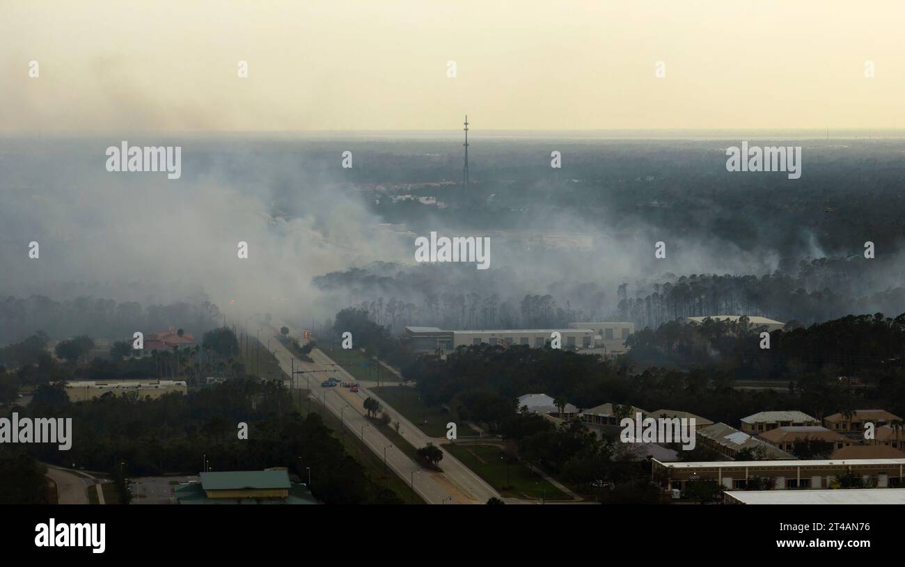 Aerial view of strong wildfire burning severely in North Port city ...