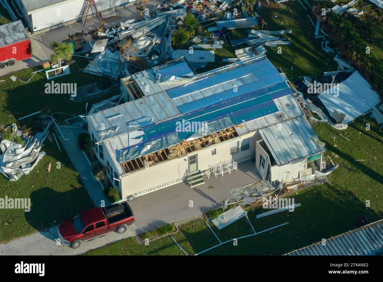 Collapsed and damaged mobile homes after hurricane Ian swept through ...