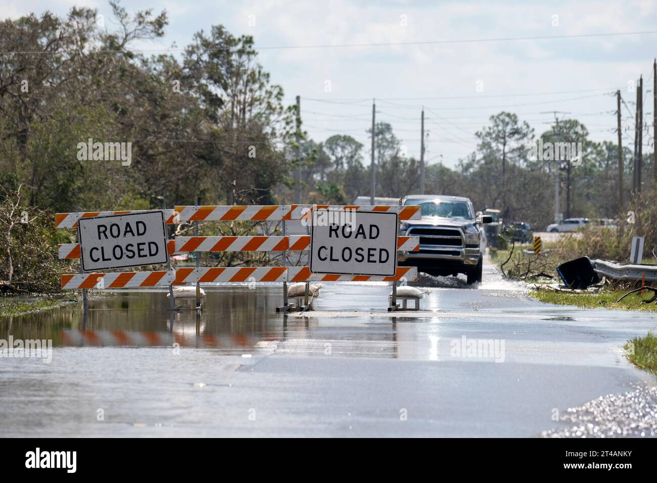 Flooded street in Florida after hurricane rainfall with road closed ...