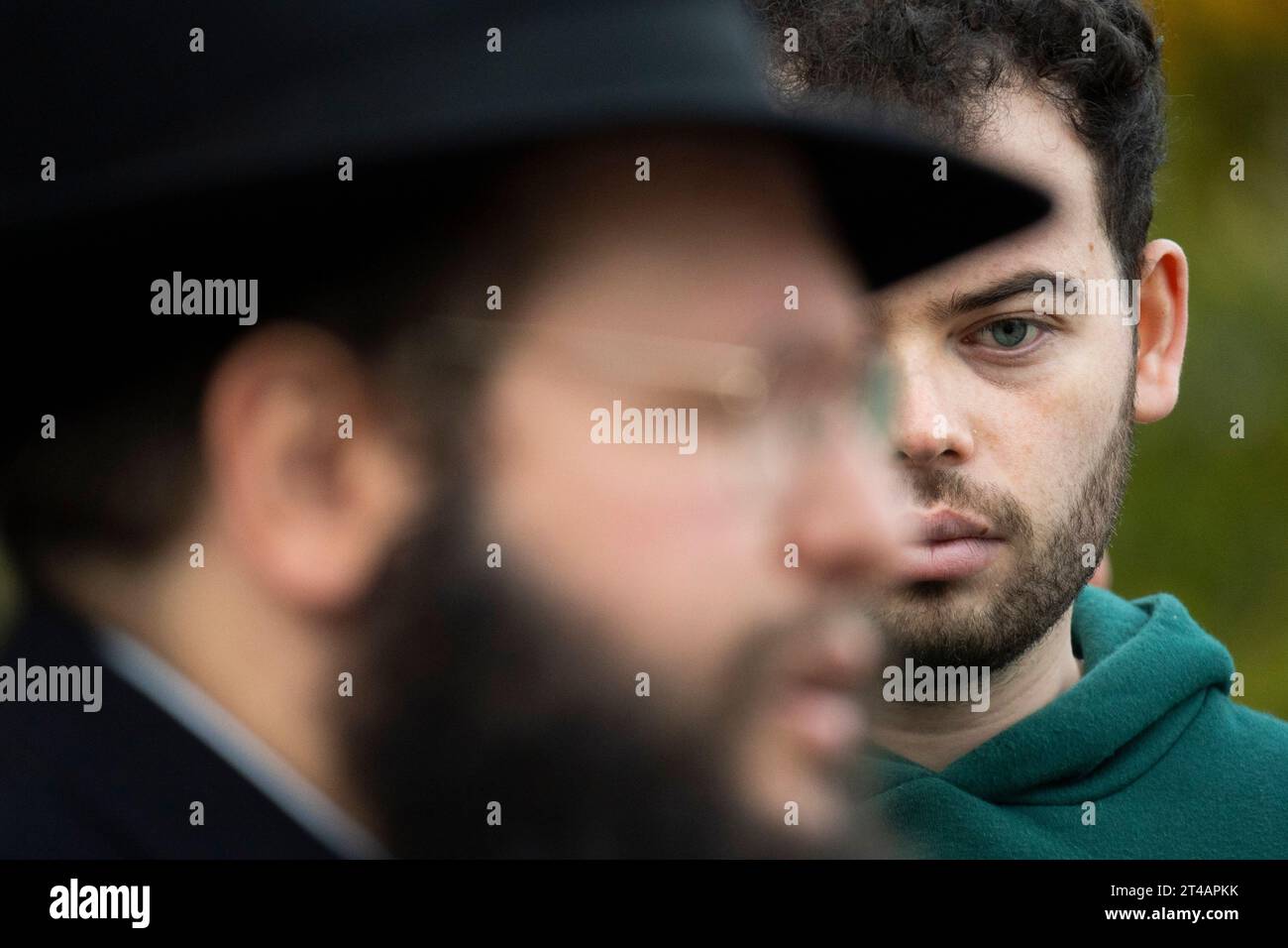 A man is seen during a vigil in Warsaw, Poland on 29 October, 2023 ...