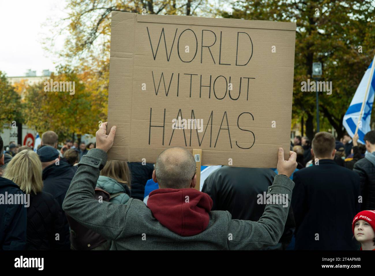 A man holds a sign reading 'World withoug Hamas' during a vigil in ...