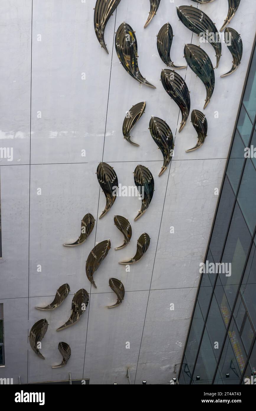 Fish sculptures on city building walls Stock Photo - Alamy